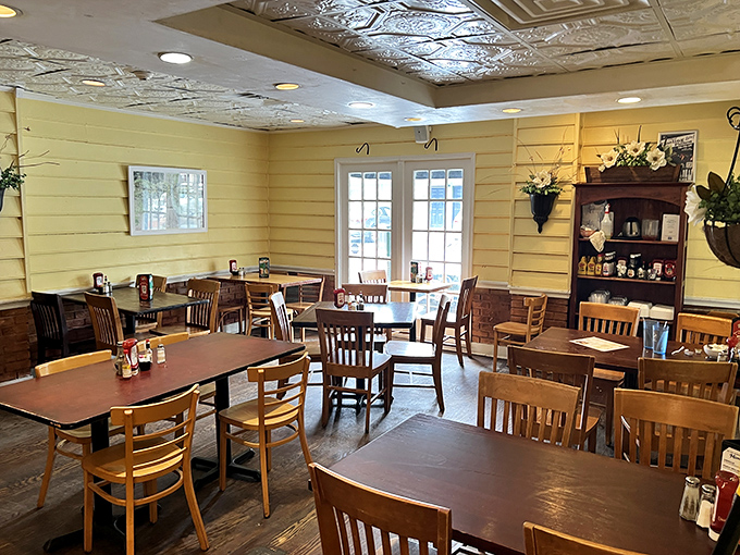 Step inside where yellow walls and wooden tables create the breakfast sanctuary your soul didn't know it needed.