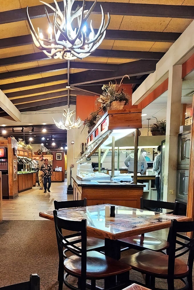 Antler chandeliers and exposed beams create the perfect rustic atmosphere for serious buffet adventures.