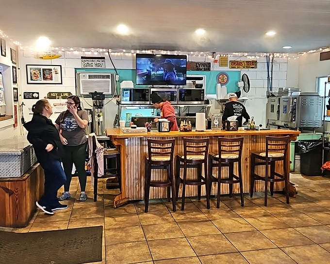 Inside Lynn's, the wooden bar and turquoise walls create that perfect "I've discovered something authentic" feeling that makes seafood taste even better.
