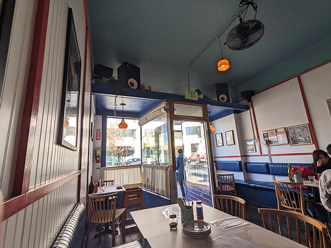 That blue ceiling and cozy vibe? It's like your coolest friend's living room, only with better pizza.