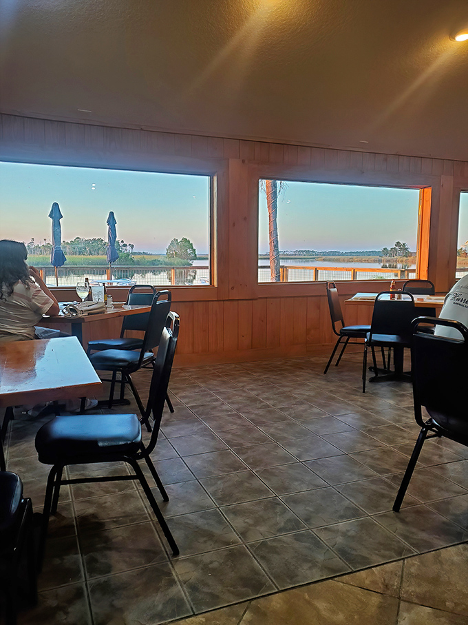 Those panoramic river views through oversized windows make every meal feel like waterfront fine dining magic.