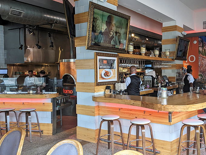 The heart of Forno: that magnificent copper-clad wood-burning oven. Like watching culinary theater as pizzas transform from dough to dream at 750 degrees.