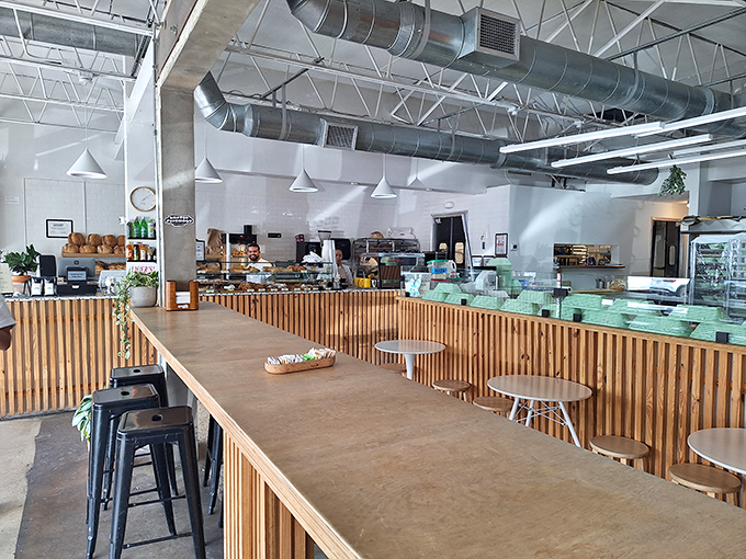 Clean lines, wooden accents, and that heavenly bakery aroma &ndash; Caracas Bakery's interior is where minimalist design meets maximum flavor potential.