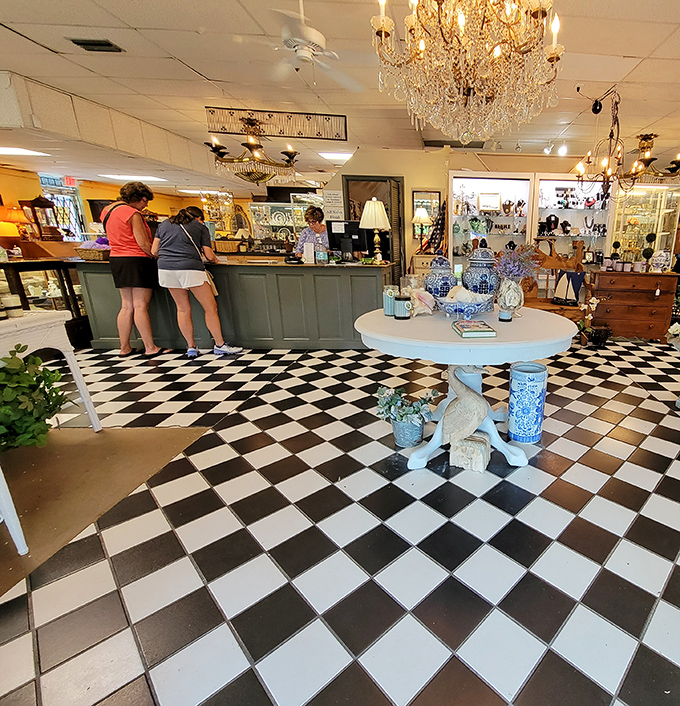Crystal chandeliers hover above a classic checkered floor&mdash;because hunting for vintage treasures should always feel this glamorous.