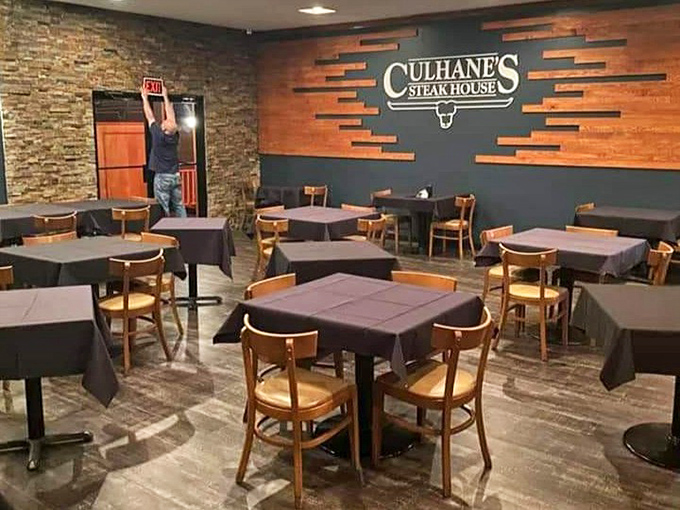 Where magic happens: Simple wooden chairs and black tablecloths set the stage for the real star&mdash;what's about to arrive on your plate.