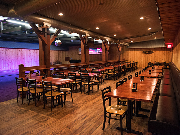 Where rustic meets revelry! Cowpoke's spacious dining room, with its wooden beams and disco ball, promises both hearty meals and potential two-stepping after dinner. 