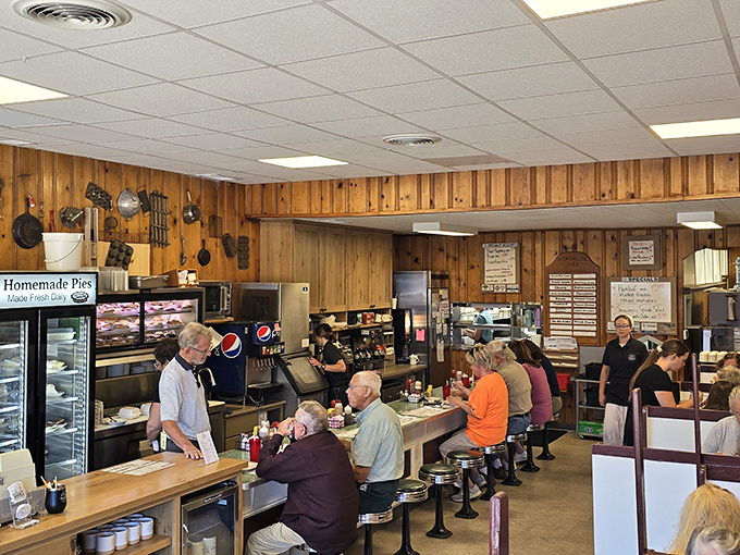 Wood-paneled walls and counter seating create the perfect time capsule – a place where conversations flow as freely as the coffee refills.