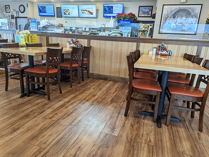 Simple wooden tables and chairs invite you to sit, stay, and savor. No pretension here&mdash;just the promise of honest food in a space that feels like coming home.