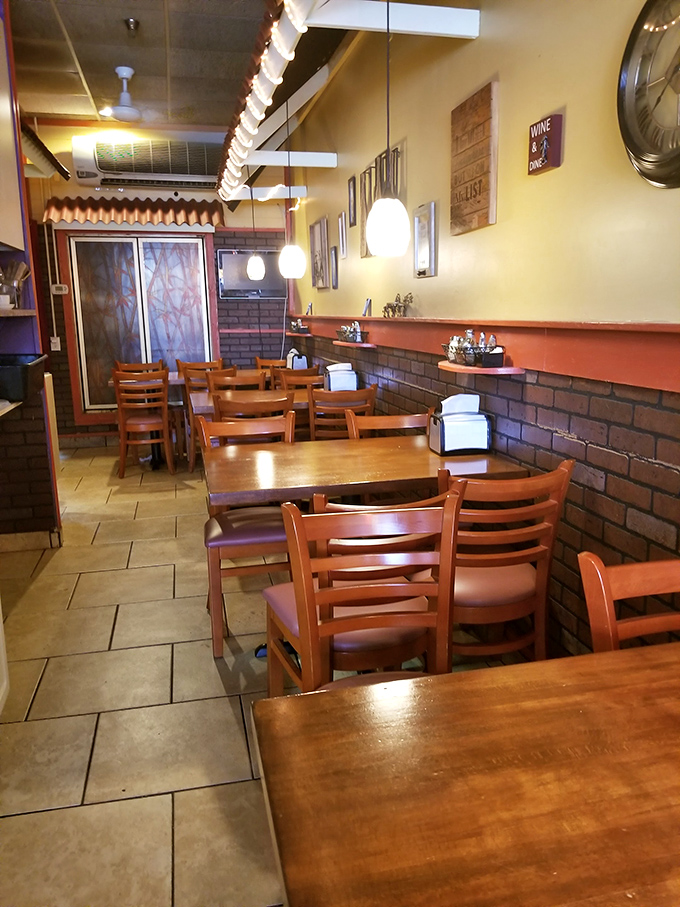 Inside Tony's, warm yellow walls and classic brick wainscoting create that "Nonna's kitchen" vibe. Simple wooden tables invite you to settle in for something special. 