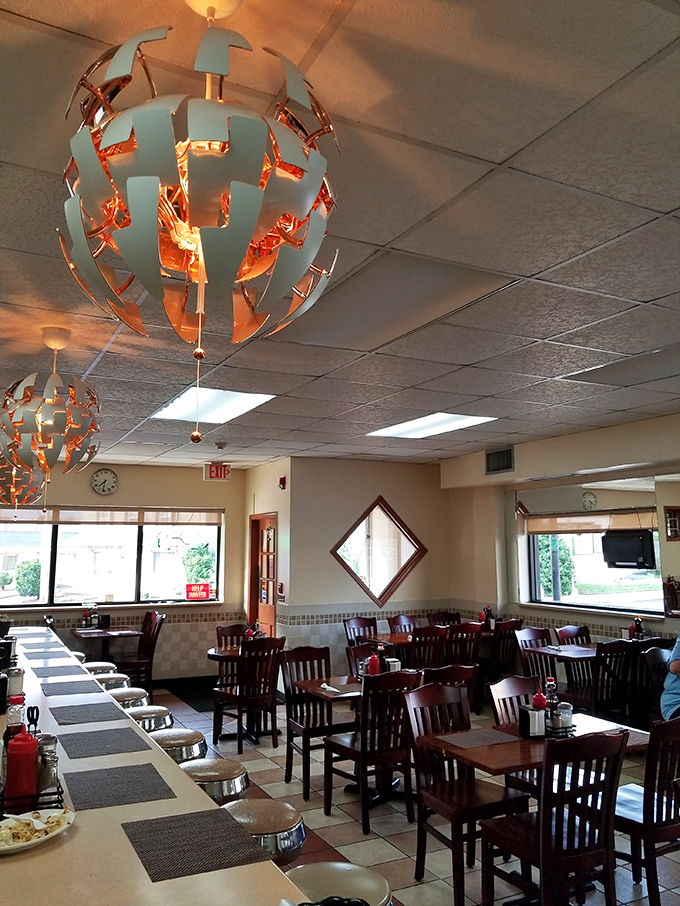 Modern meets classic under these distinctive light fixtures. The dining room balances comfort and style – the perfect canvas for waffle artistry.