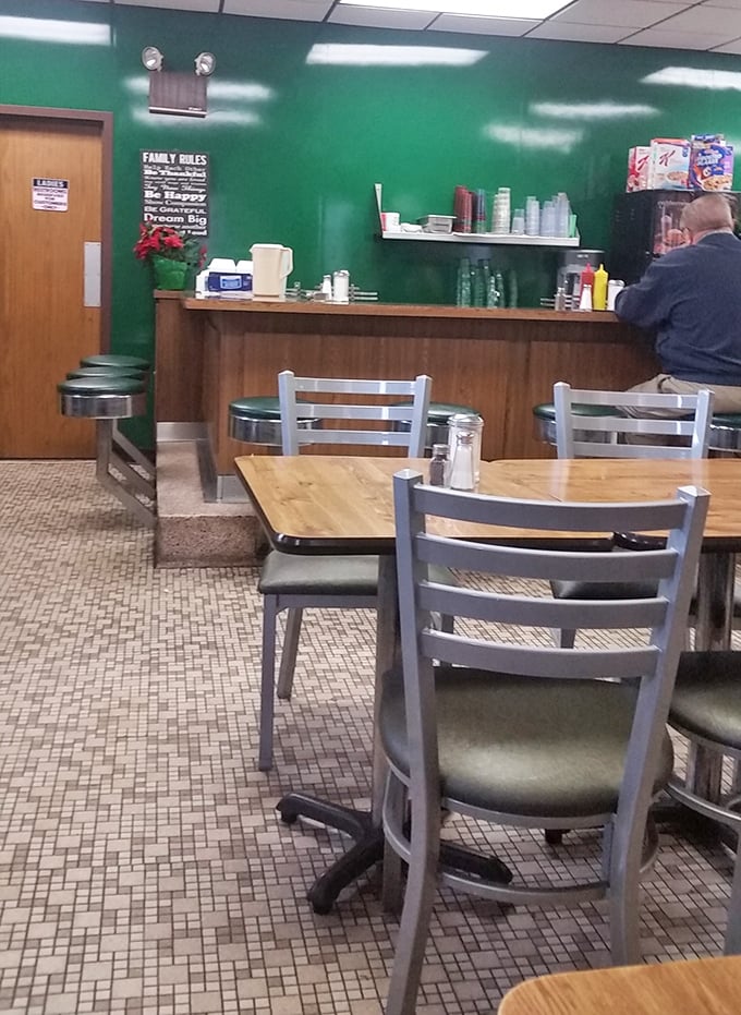 Inside, the vibrant green walls and no-nonsense seating tell you everything you need to know&mdash;this place prioritizes what's on your plate, not what's on their walls.