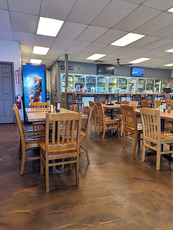 Simple wooden tables and chairs create that "everybody knows your name" vibe, while coolers line the wall with beverages waiting to quench your thirst. 