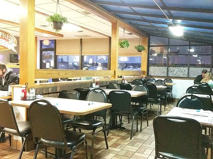 Classic diner ambiance with hanging plants and comfortable seating &ndash; where conversations flow as freely as the coffee and nobody's checking their Instagram.