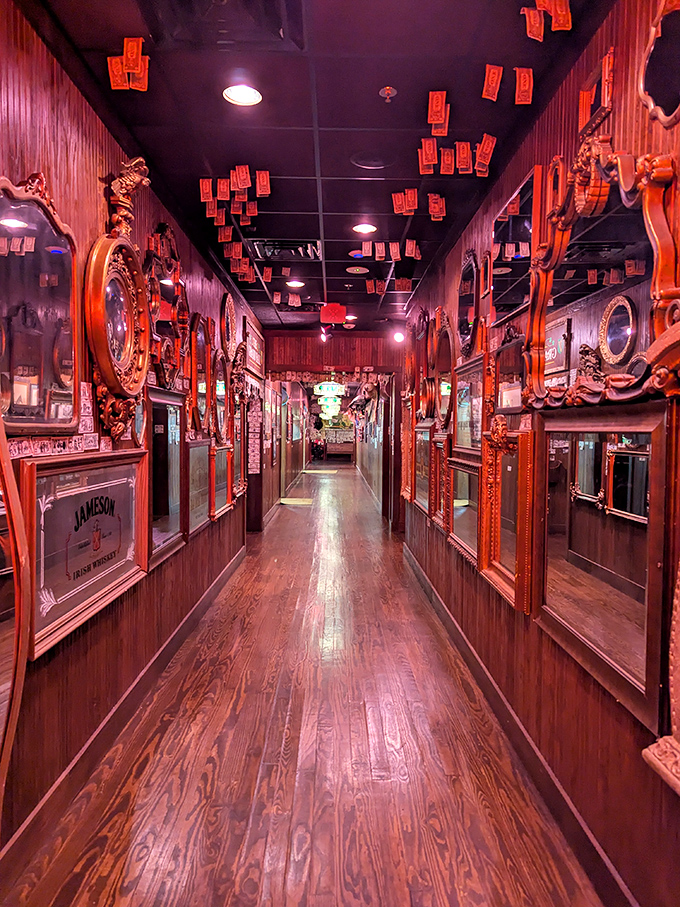 Dollar bills flutter from the ceiling like rectangular confetti in this wood-paneled corridor. Walking through feels like entering an Irish pub designed by a currency-obsessed leprechaun.