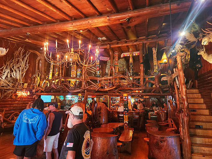 Where dining meets wonderland: tree roots twist into furniture while antlers and carvings create a space that's equal parts Polish tavern and enchanted forest.