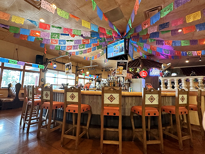 Colorful papel picado banners create a perpetual fiesta overhead while the warm wood tones of the bar invite you to settle in for margarita o'clock.