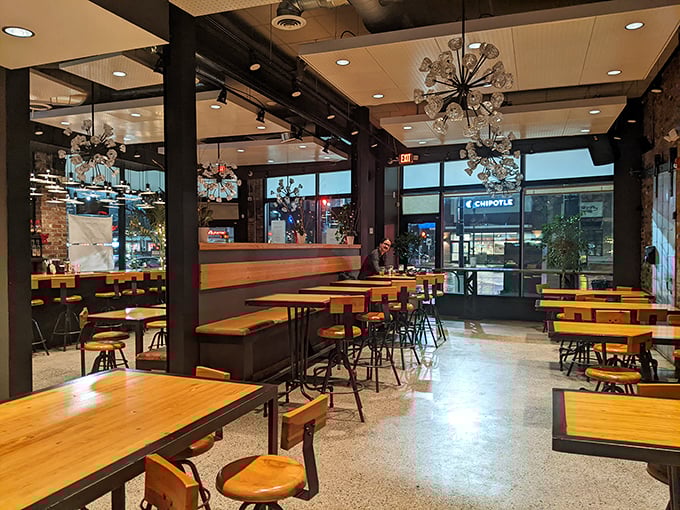 Modern meets comfort in this light-filled space where industrial chic somehow feels as cozy as your favorite armchair.