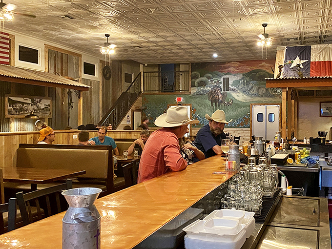 Where Texas pride meets comfort &ndash; cowboy hats aren't just decoration here, they're standard dinner attire. The mural backdrop tells stories while you create your own. 