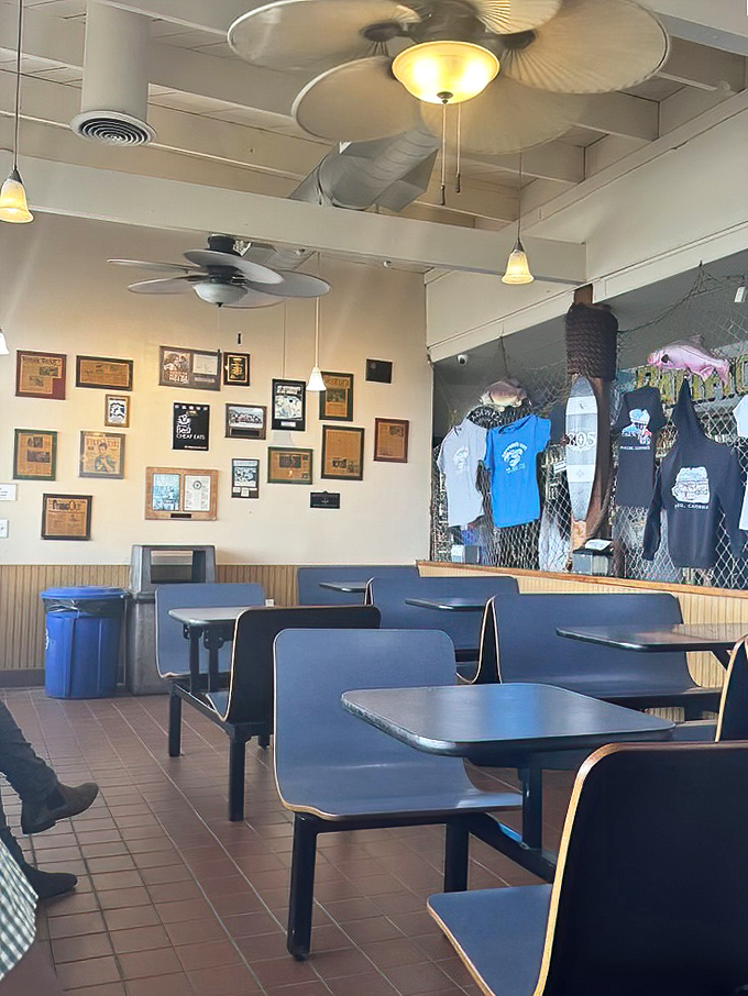 Inside Neptune's Net, nautical nostalgia meets casual comfort. The walls tell stories of ocean adventures while ceiling fans lazily spin above diners plotting their seafood strategy.