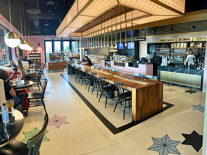 Step inside where warm wood meets cool sophistication, and every corner whispers sweet possibilities.