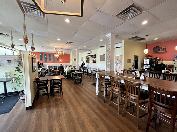 That coral accent wall isn't just decor &ndash; it's a warm hug that says "stay awhile."