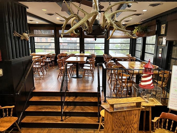 Antlers overhead and nautical charm throughout—this dining room feels like the cozy cabin of a ship captained by someone with excellent taste in seafood.
