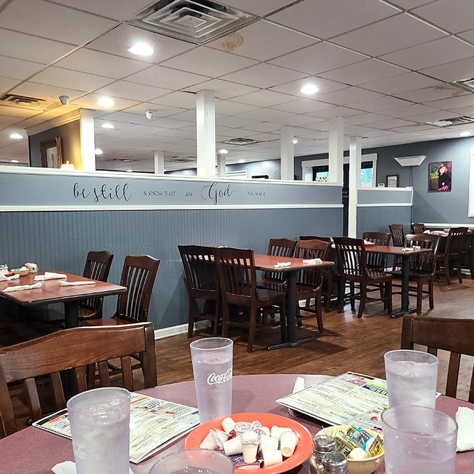 Blue wainscoting and wooden chairs create that "grandma's dining room" feel. The scripture on the wall reminds you to slow down and savor every bite.