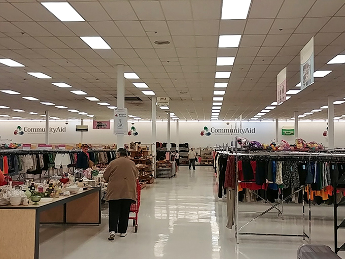 Aisles that stretch toward the horizon promise adventures in thrifting. The fluorescent lights illuminate possibilities rather than just merchandise.