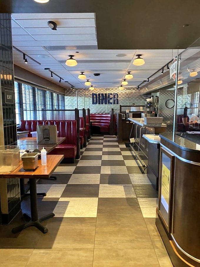 Classic diner aesthetics meet upscale comfort at Cap City, where those red vinyl booths practically whisper "slide in and stay awhile."