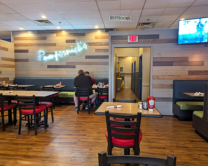 Wood-paneled walls, cozy booths, and that glowing neon sign &ndash; Pumpernick's dining room feels like the living room of your favorite food-obsessed relative.