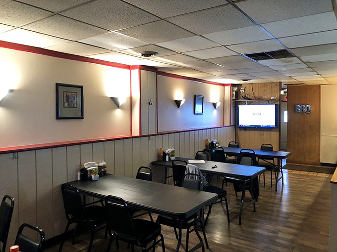 Simple tables, red trim, and zero pretension &ndash; this dining room isn't trying to impress you until the food arrives.