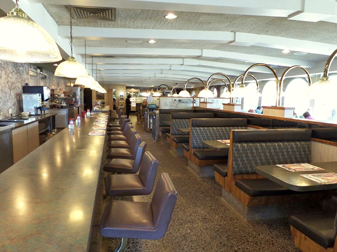 Classic diner perfection: the counter where regulars claim their territory and booths where families have created Sunday morning traditions for generations.