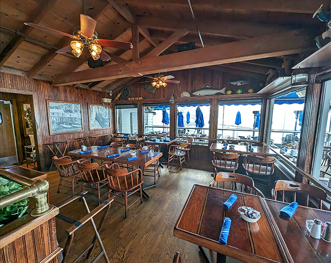 Rustic wooden beams meet panoramic ocean views in a dining room that screams "maritime charm" without having to resort to plastic lobsters on the wall.