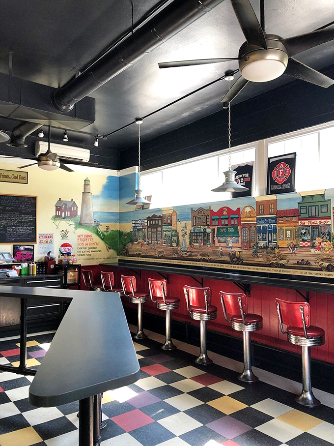 Step inside where red vinyl stools and nostalgic murals create pure diner magic.