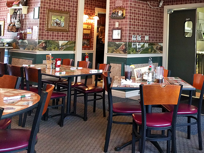 Red checkered wallpaper and wooden tables create that classic "your Italian neighbor's dining room" vibe&mdash;comfortable, unpretentious, and ready for serious eating. 