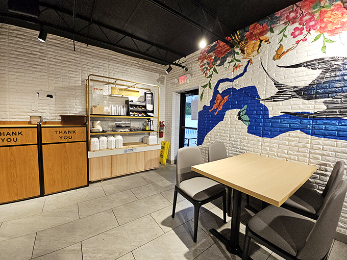 Clean white walls adorned with artistic flourishes create a space that's both modern and welcoming. Minimalism never tasted so good.