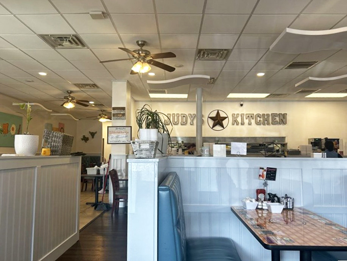 Inside Judy's Kitchen, ceiling fans lazily spin above blue booths and wooden tables, creating that perfect diner atmosphere where time slows down just enough.