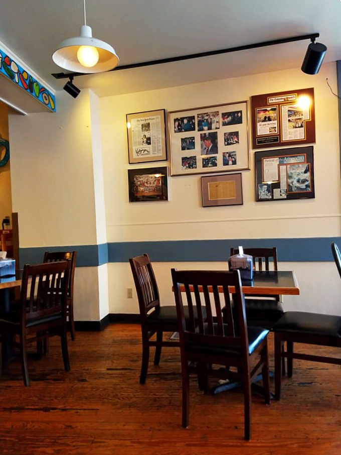 Step inside where framed memories and warm lighting create the perfect backdrop for exceptional dining.