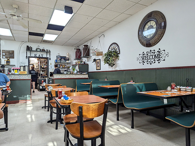Classic diner aesthetics with teal booths and wooden tables create that perfect "come as you are" vibe. Time slows down when you're in comfort food territory.