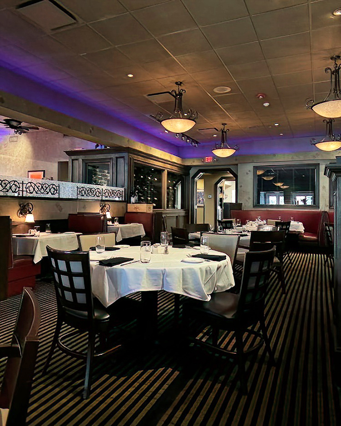 Purple mood lighting and crisp white tablecloths create that perfect "I'm-treating-myself-tonight" atmosphere that makes every bite taste just a little better.