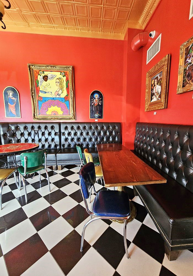 Vibrant red walls adorned with eclectic artwork create the perfect backdrop for food that's equally colorful and bold.