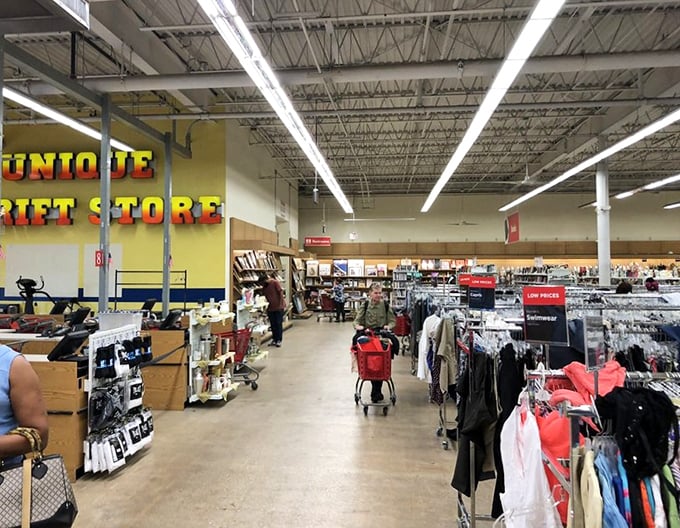 Endless aisles stretch before you like a secondhand universe, where shoppers navigate the galaxy of previously-loved possibilities.