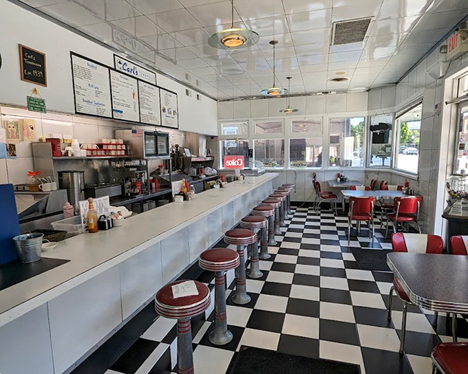 Classic Americana in black and white tiles with a splash of red vinyl. This isn't retro by design&mdash;it's authentic by survival.