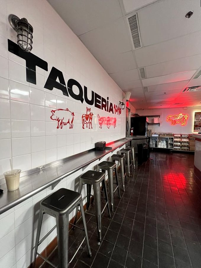 White tiles, metal stools, and animal silhouettes create a no-nonsense interior where the only decoration needed is the anticipation of great tacos.