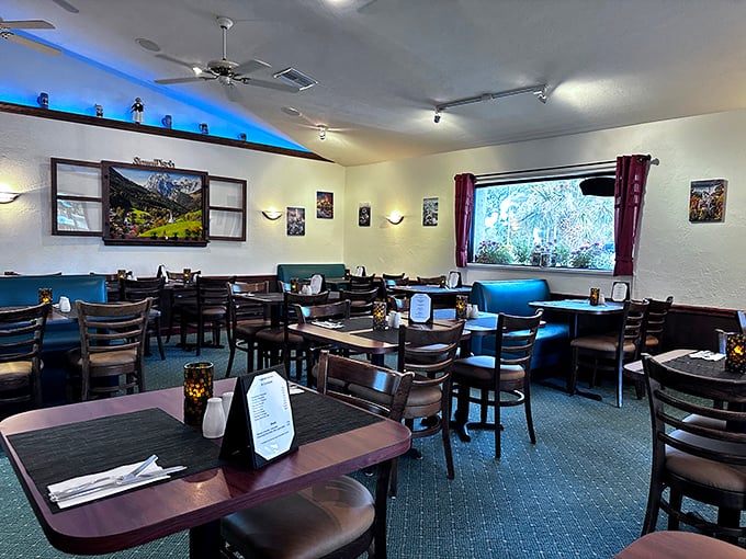 Blue accent lighting creates a cozy Alpine atmosphere inside, where every table feels like the best seat in a Munich beer hall.