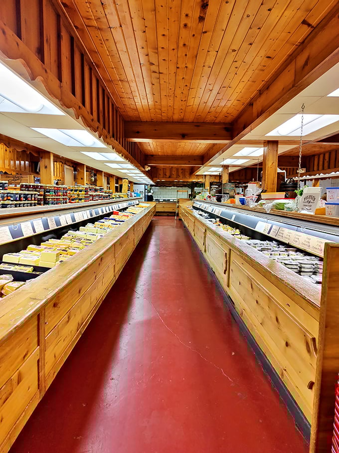 Wooden beams, red floors, and cheese as far as the eye can see. Walking this aisle feels like entering the Willy Wonka factory for grown-ups with sophisticated palates.