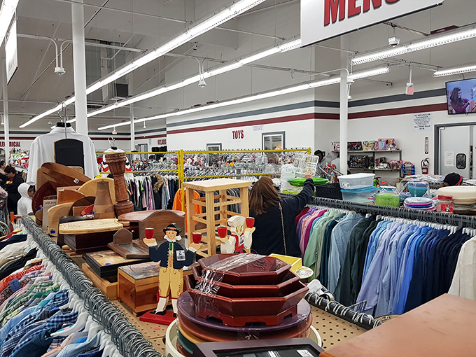 A thrifter's paradise unfolds inside, where men's clothing meets furniture, decorative items, and the promise of unexpected discoveries around every corner.