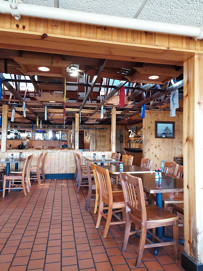 Knotty pine paneling and nautical touches create that perfect "come as you are" atmosphere where memorable meals and conversations naturally flow.