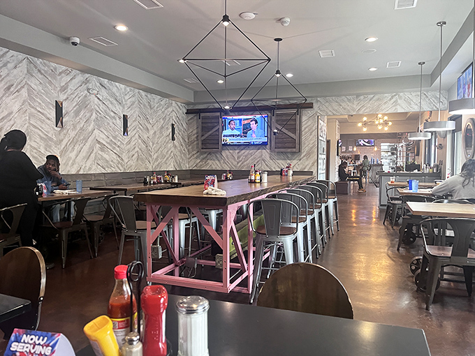 Inside, modern meets homey with that signature pink community table. It's where strangers become friends over shared maple syrup moments.