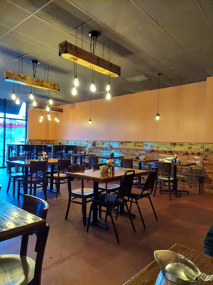 Edison bulbs dangling from rustic wooden beams create that perfect "Instagram-worthy but I'm not trying too hard" lighting that makes everyone look like food critics.